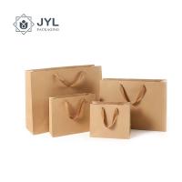 China Custom Logo Ribbon Handle Paper Bag 1000pcs MOQ Moistureproof Cosmetic Packaging for sale