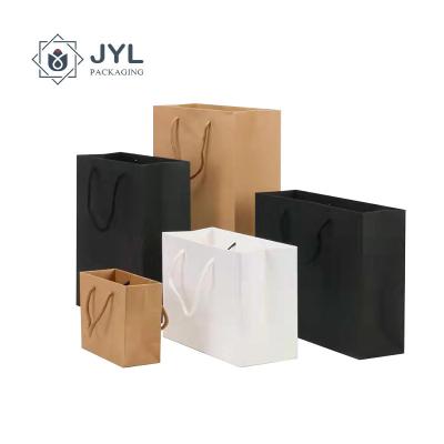 China Custom Logo Ribbon Handle Paper Bag 1000pcs MOQ Moistureproof Cosmetic Packaging for sale