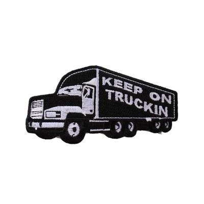 China Custom Embroidered Patches Cartoon Truck Artwork Iron On Decorative Badges 100pcs MOQ for sale