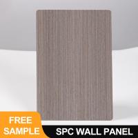 China SPC Wall Panel 600*2440*4mm Waterproof Stone Plastic Eco-Friendly Wood Grain Seamless Locking  Interior Decoration Board for sale