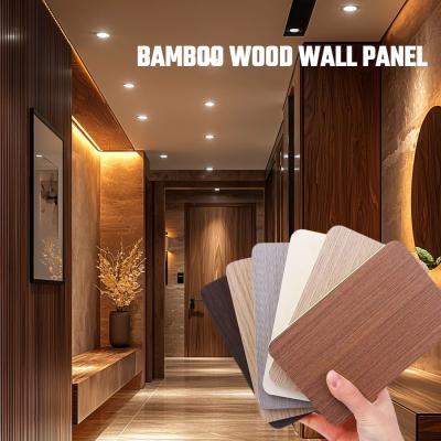 China Modern Bamboo Charcoal Wood Veneer Indoor Decorative PVC Wood Grain Wear Resistant Wall Panel Cladding For Home And Hotel for sale