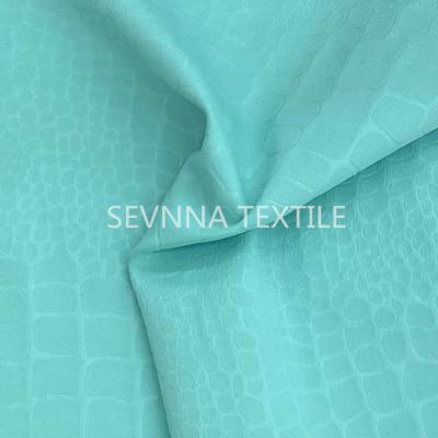 China Recycled Eco Friendly Swimwear Fabric Embossed Print Women Beach Wear for sale