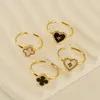 China Heart Shaped Stainless Steel Open Ring for Female Niche High-End Four Leaf Clover Titanium Steel Love Heart Shaped Pattern Ring Jewelry Smr675 for sale