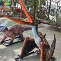China 3D Fiberglass Realistic Looking Dinosaurs Struggled Pterosauria Statue Outdoor for sale