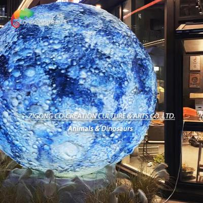 China Ethereal Lunar Sculpture: Crater-Textured Moon Statue In Dreamy Blue Gradient​ for sale