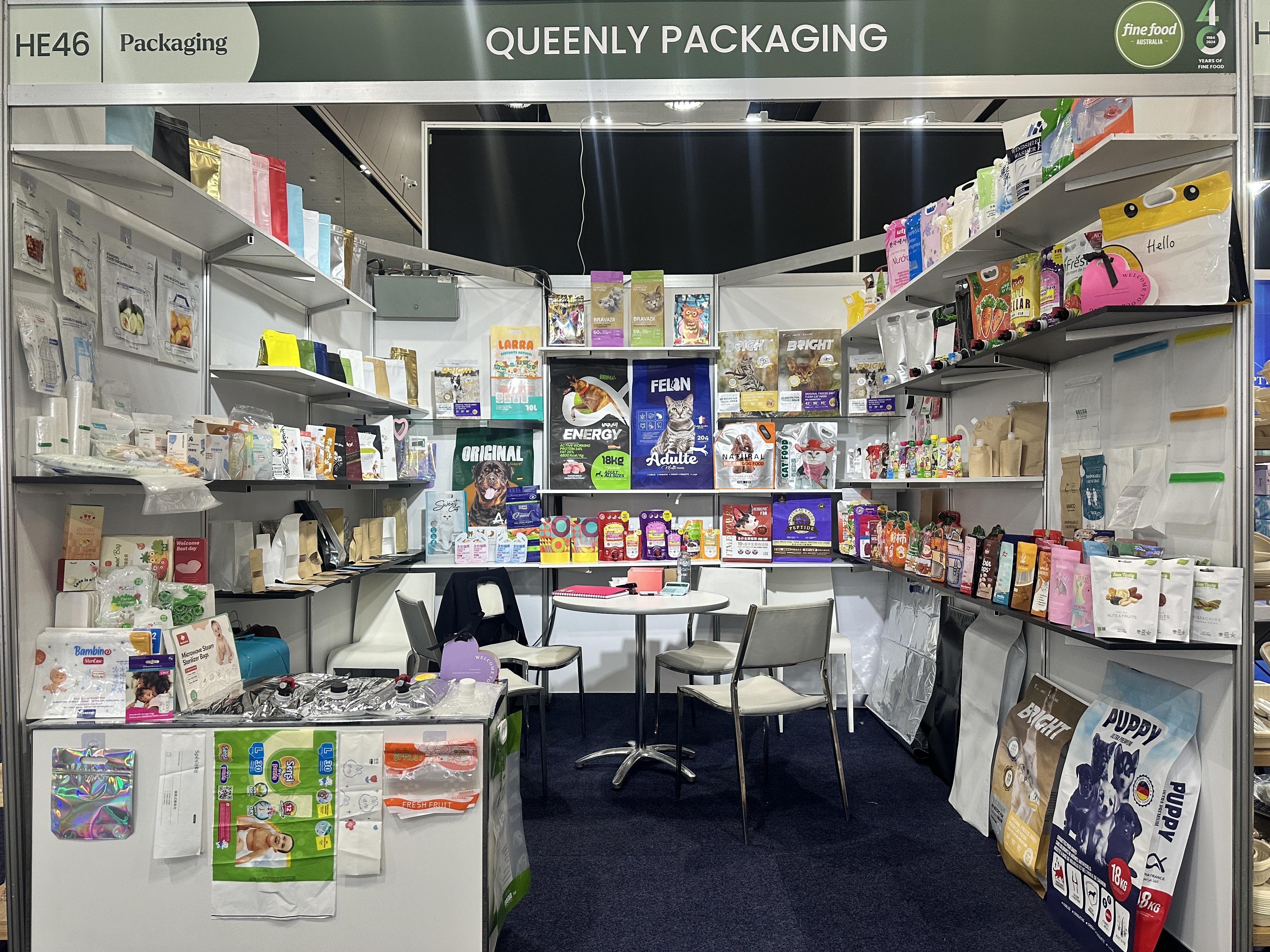 Queenly Packaging booth at food exhibition, showcasing custom food and pet food packaging pouches