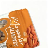 China Custom Printed Stand‑Up Zipper Bag with Heart‑Shaped Window | 150g 350g Nut Packaging Pouch for Almonds & Dry Fruits for sale