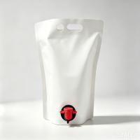 China Custom Matte Black Stand Up Wine Spout Pouch With Dual Carry Cutouts | Custom Shape Printed High Barrier Dispenser Bag For White Wine, Fruit Wine & Beverage Concentrate for sale