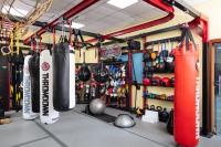 China Wall Mount Free Weights Storage Rack Multifunctional Heavy Duty Punch Bag Bracket for sale