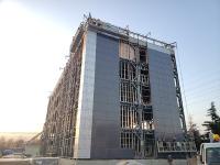China Q355B Steel Structure Commercial Building with 75mm Rock Wool Wall Panels and V688 Steel Decking for Office and Warehouse Construction for sale