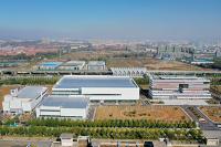 China Steel Frame Prefabricated Building with 50+ Year Durability - Q355/Q235B Steel, 5-15MT Crane Capacity for sale