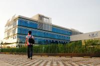 China Q235B Prefab Steel Commercial Building with 50+ Meter Clear Span and Hot-Dip Galvanized Finish for sale