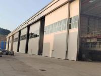 China Custom Prefabricated Steel Aircraft Hangar with 5MT-15MT Crane Capacity and Hot-Dip Galvanized Surface Protection for sale