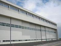 China Custom Prefabricated Steel Aircraft Hangar with 5MT-15MT Crane Capacity and Hot-Dip Galvanized Surface Protection for sale