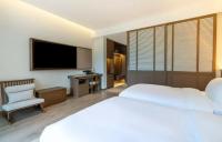 China Contemporary Hotel Guest Room Furniture OEM ODM Hotel Bedroom Furniture Warm Wood Tones for sale
