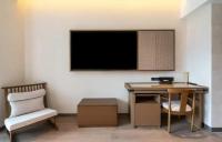 China Contemporary Hotel Guest Room Furniture OEM ODM Hotel Bedroom Furniture Warm Wood Tones for sale