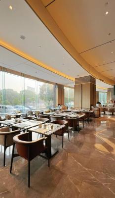 China Practical Contemporary Dining Table Set Warm Hotel Dining Table And Chairs Drawing Based for sale