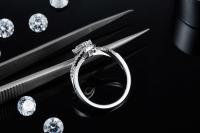 China Simple Arrival S925 Bright Setting Women Infinity Round Cut Moissanite Ribbon Twist Wedding Engagement Ring for sale