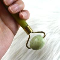 China Xiuyan Jade Skin Care Jade Stone Facial Eye Therapy Skin Tightening Spa Wrinkle Remover Massager Face Roller With Flower Handle for sale
