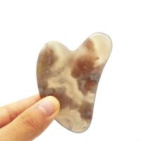 China Body Massager Natural Heart Shape Cherry Blossom Agate Gua Sha Board Care Guasha Massage Tool with Custom Logo for sale
