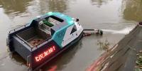 China Unmanned Weedoo Aqua Harvester TITAN Lake Weed Cutter Boat 800mm Depth for sale