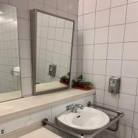 China Modern Wall-Mounted Stainless Steel Tilt Mirror IP44 Rated Rectangular for Elderly Care Homes Public Restrooms Disabled Access for sale
