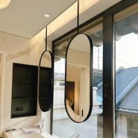 China Double-Sided Stainless Steel Oval Bathroom Mirror Hanging Ceiling Suspended Mirror for Hotels and B&Bs with Hanging Rod for sale
