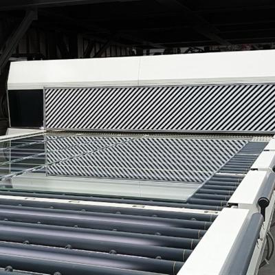 China Low Iron Solar Glass tempered glass with superior light transmittance and packaging prepared for secure container loading for sale