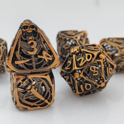 China Skull Metal Hollow Dice Set DND Dungeons And Dragons Polyhedral RPG Hollow Digital for sale