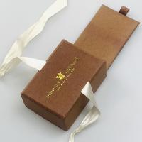 China Texture Paper Gift Packaging Box Gold Foil Crossed Ribbon Bow EVA Insert For Cosmetic for sale
