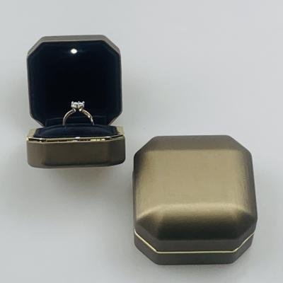 China Luxury Paper Jewellery Packaging Boxes Special Square Led Light Golden PU Leather With Soft Velvet Insert for sale