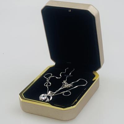 China Earring Necklace Paper Jewelry Box Rectangle Golden PU Leather With LED Lights Black Velvet Insert for sale