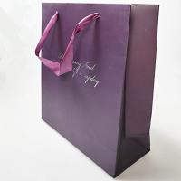 China Ribbon Handle Purple Paper Bag Silver Stamping Logo Bowknot Jewelry Gift Shopping Bag for sale
