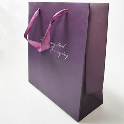 China Ribbon Handle Purple Paper Bag Silver Stamping Logo Bowknot Jewelry Gift Shopping Bag for sale