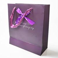 China Ribbon Handle Purple Paper Bag Silver Stamping Logo Bowknot Jewelry Gift Shopping Bag for sale