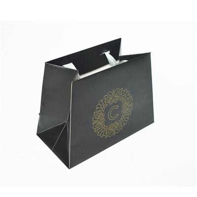China Glossy Lamination Printed Paper Carrier Bags Black Gift Bags With Ribbon Handles for sale
