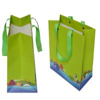 China Christmas Recycled Paper Gift Bags Pantone CMYK Printed Ribbon Handle Bags for sale
