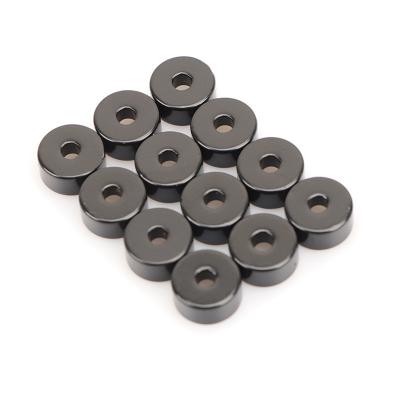 China NdFeB Magnet Round Counterbore Special Shape Black Epoxy Coating Grand N42 magnet SST test over 96 hrs for sale