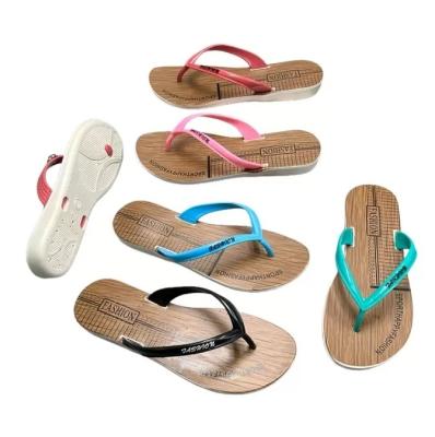 China PVC Women Wood Grain Sole Casual Flip Flops for sale