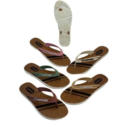 China PVC Women Wood Grain Sole Thongs With Brand Logo And Neutral Tone Strap for sale