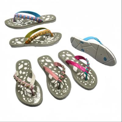 China PVC Women Ethnic Braided Bead Strap Thongs With Floral Cutout Sole And Geometric Traction for sale
