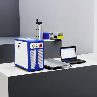 China 10W 20W Fiber Laser Marking Machine Silver Gold Inside Ring Laser Marking Machine for sale