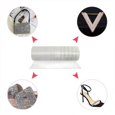 China Double Layer Self Adhesive Hot Melt Glue Film with 160-180℃ Heat Activation for Hot Fix Rhinestone Decoration for sale