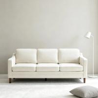 China Bright Cream Upholstered Three Seater Sofa for Modern Living Room Household Interior Styling for sale