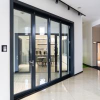 China Two Way 6063 Aluminum Folding Door With Digital Handle Black Color Frame for sale
