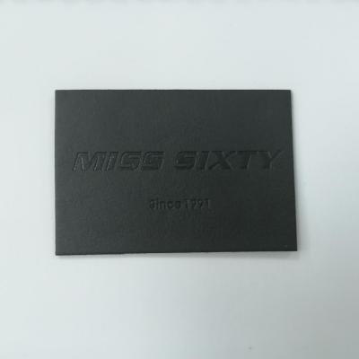 China Embossed Logo Suede Microfiber PU Leather Label Washable Custom Color for sale