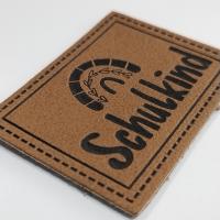 China Microfiber Embossed Logo PU Leather Label Sew On Clothing Customize Design for sale