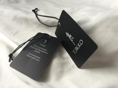 China Both Side Silver Logo Art Paper Clothing Hang Tags with Black Waxed Cord - 200 pcs per pack, 3000 pcs daily capacity for sale