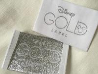 China Disney Gold Foil Woven Clothing Labels - 50-150 Denier Yarn with Ultrasonic Edge Cutting for sale