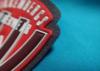China Custom Logo Embossed Self Adhesive Silicone Clothing Patches 3D Rubber Labels 25x22mm for sale